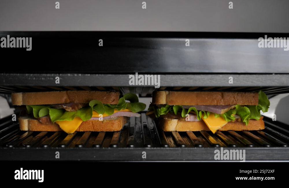 Cooking sandwiches on an electric grill. white bread toast Stock Video ...