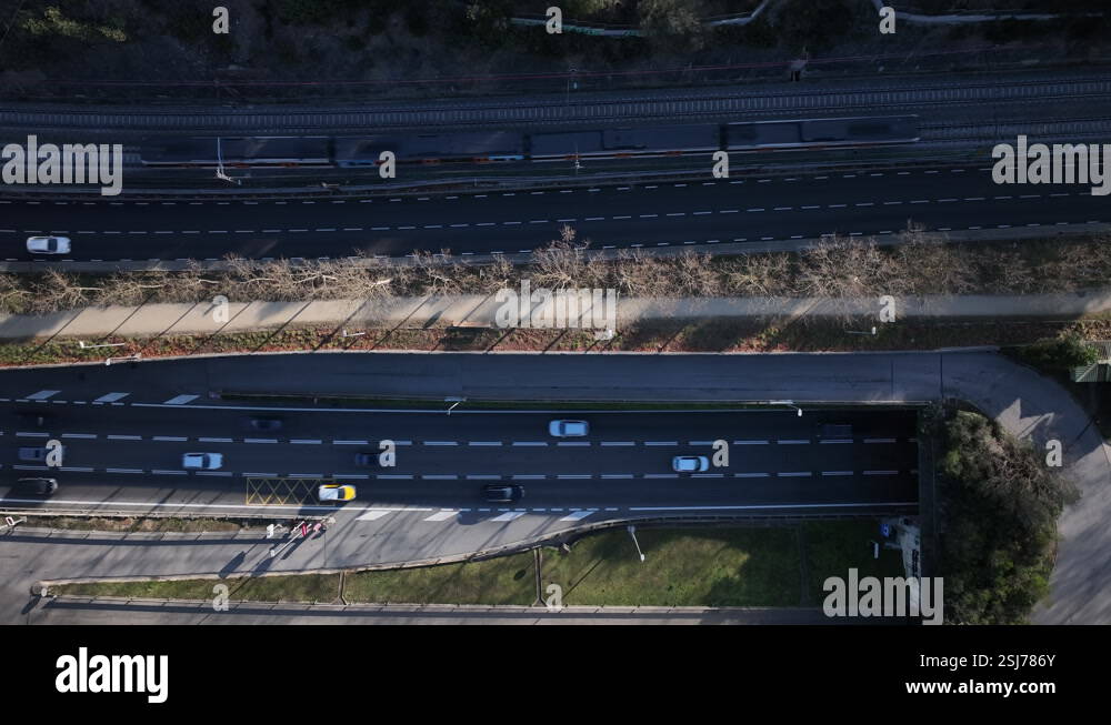 Aerial flyover view of busy traffic driving rush hour highway with ...