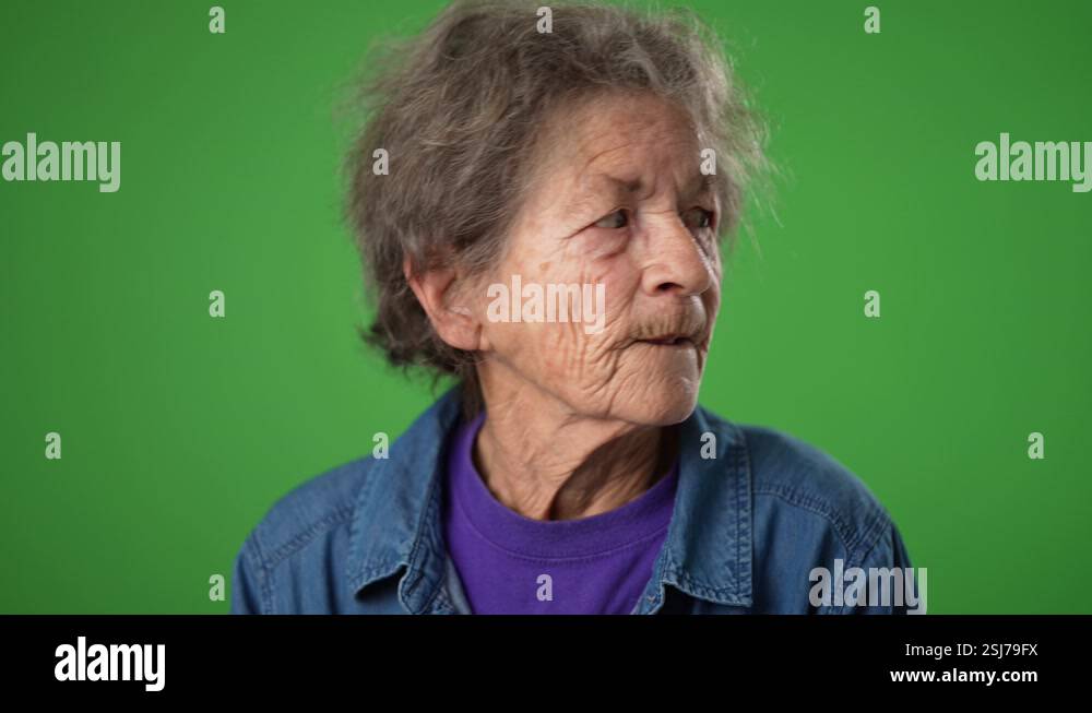Closeup slow motion portrait of toothless elderly senior old woman with ...