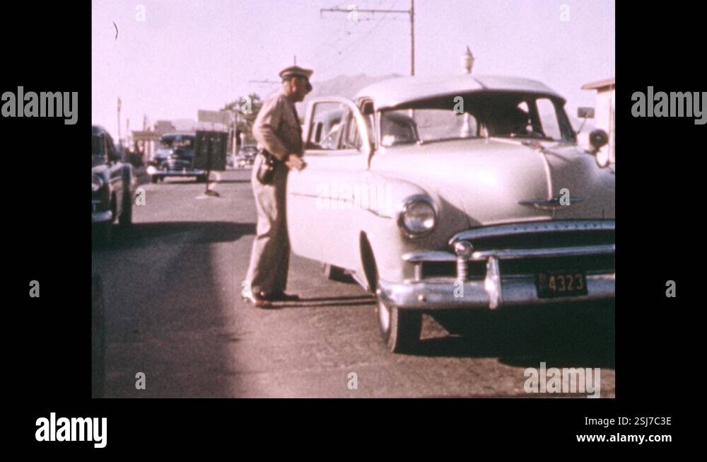 1950s: border patrol officer inspecting car crossing the border, map of ...