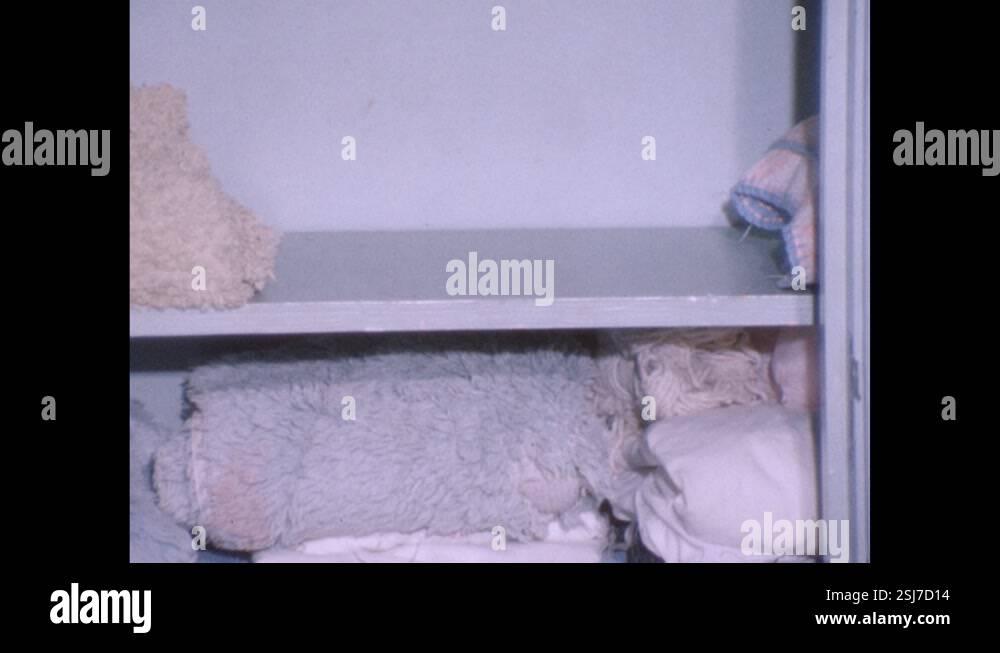 1960s: Hand with paper. Hands open door, take rope from shelf. Hands ...