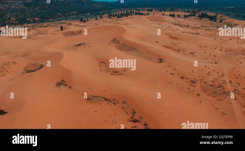 Drone forward tilt up over orange desert sand dunes in Utah, USA, mars ...