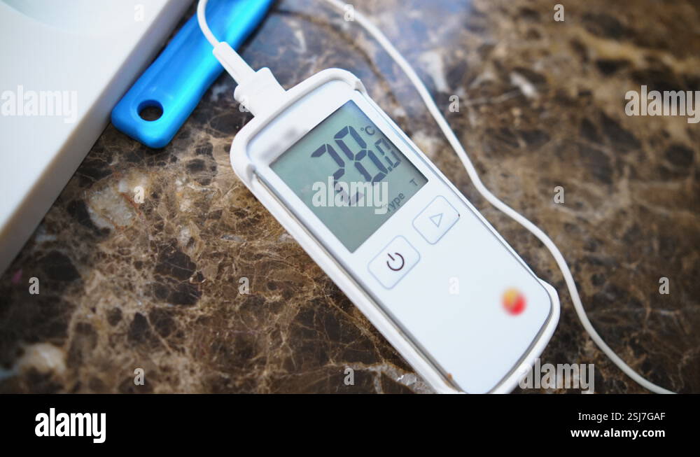 Measuring temperature using a device on the kitchen counter while ...