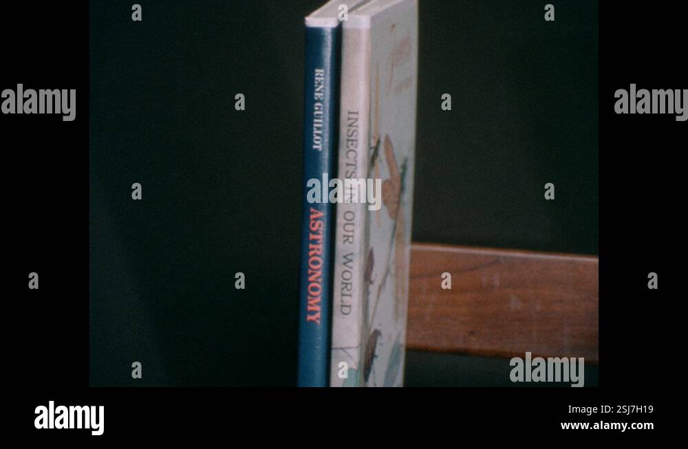1960s: Two books sit on left side bookshelf. Five books sit on right ...