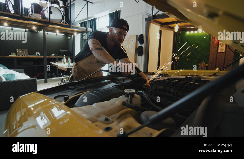 Auto Mechanic In Goggles Welding Detail In Car Engine In Parking House ...
