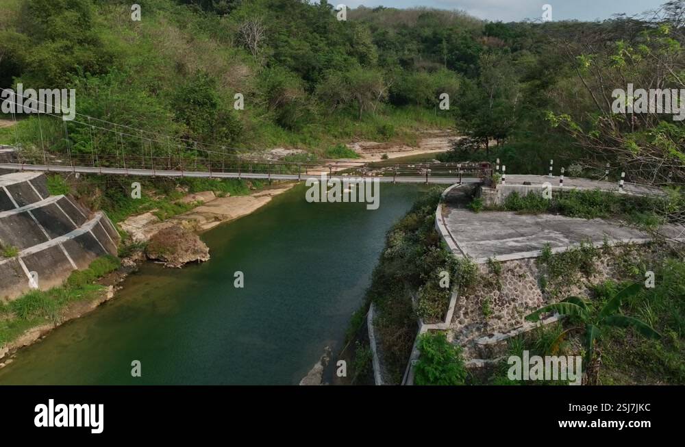 Drone passing over Gantung Wanagama Bridge (Jemabatan) at the start of ...