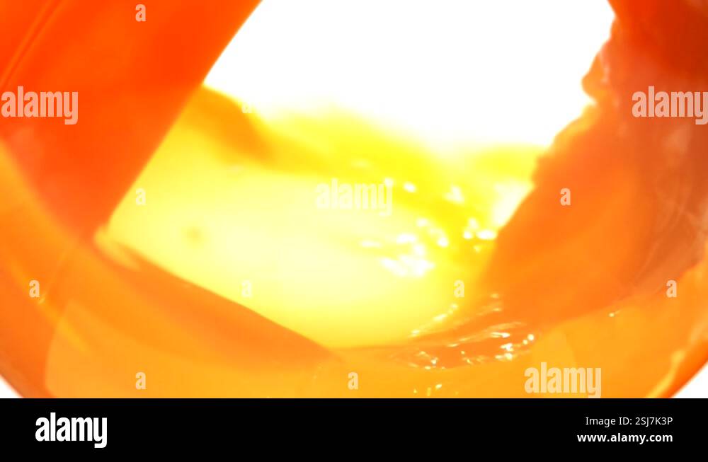 An appetizing wave of mango juice swirls inside the glass Stock Video ...