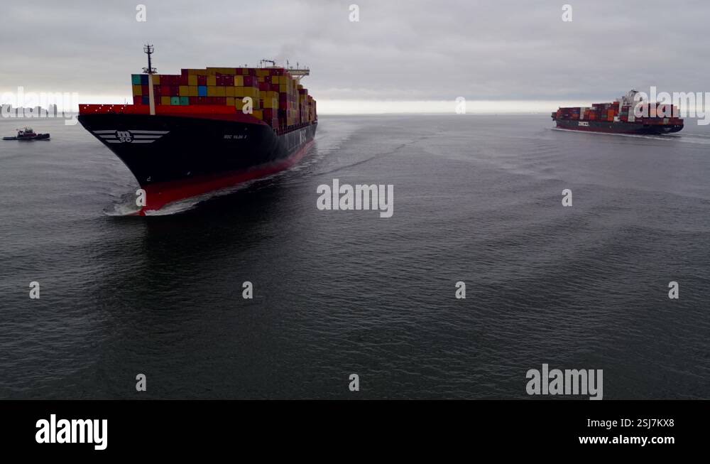 A low altitude view of two cargo ships transporting goods on the Hudson ...