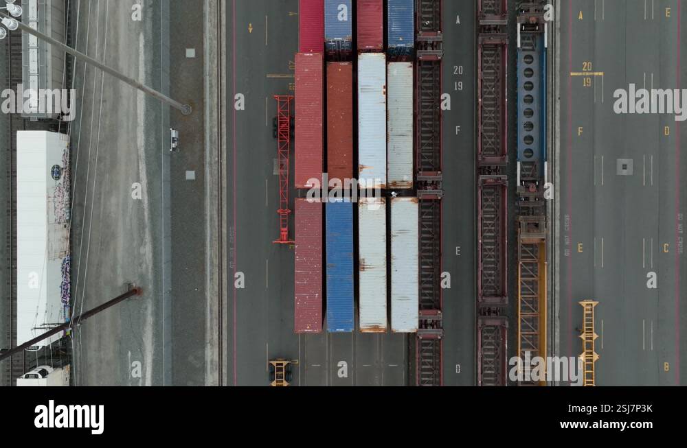 Overhead aerial view lowering over loaded train carts in the Port of ...