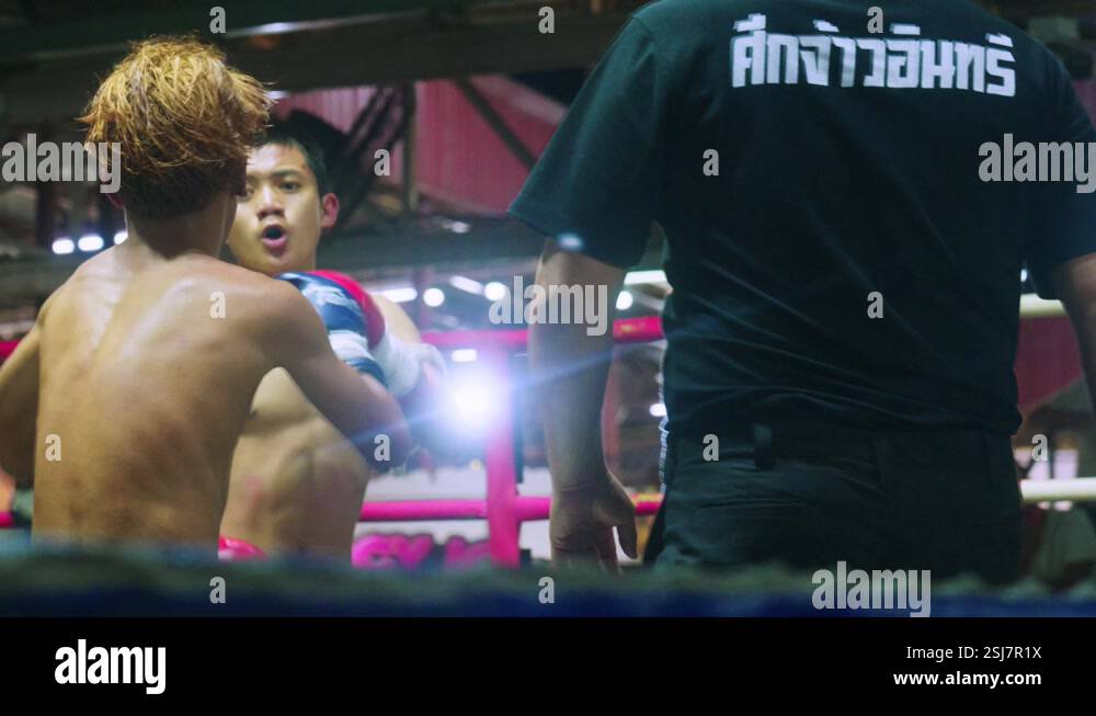 4K Cinematic slow motion footage of two young Thai men fighters on a ...