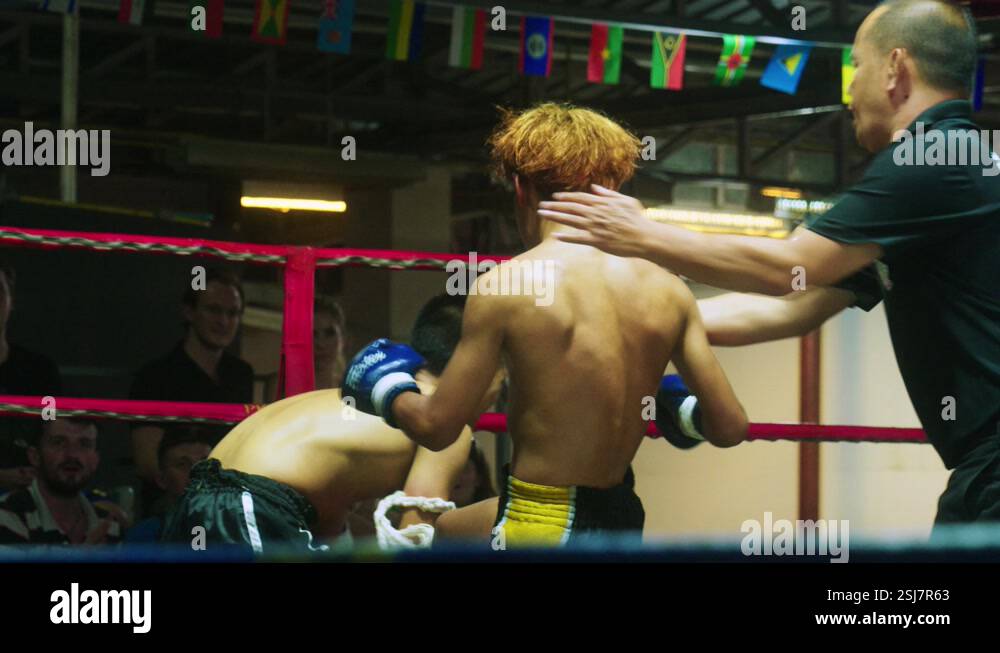 4K Cinematic slow motion footage of two young Thai men fighters on a ...
