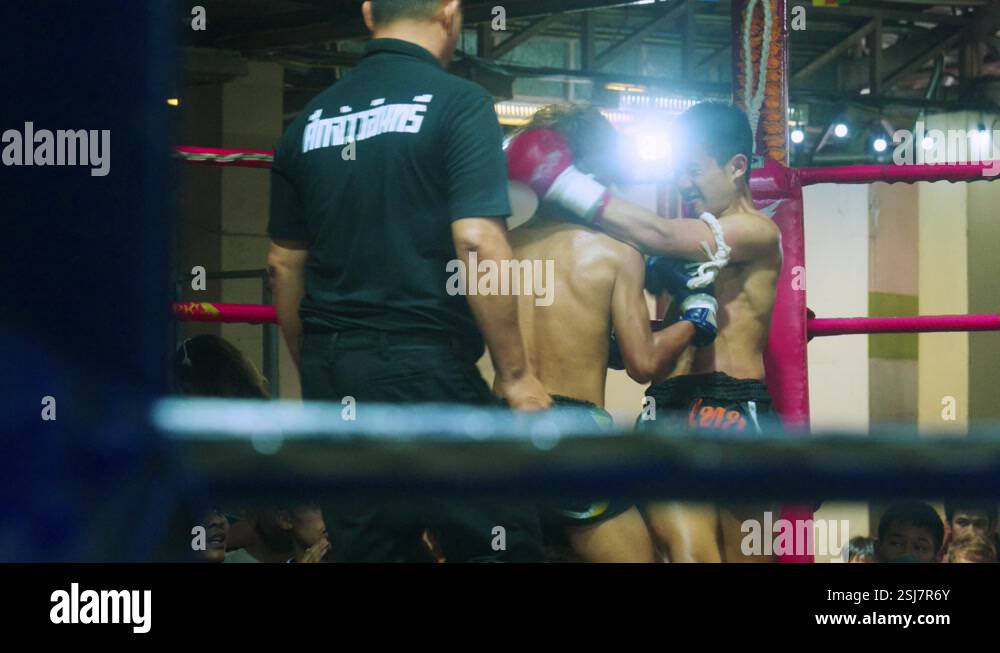 4K Cinematic slow motion footage of two young Thai men fighters on a ...