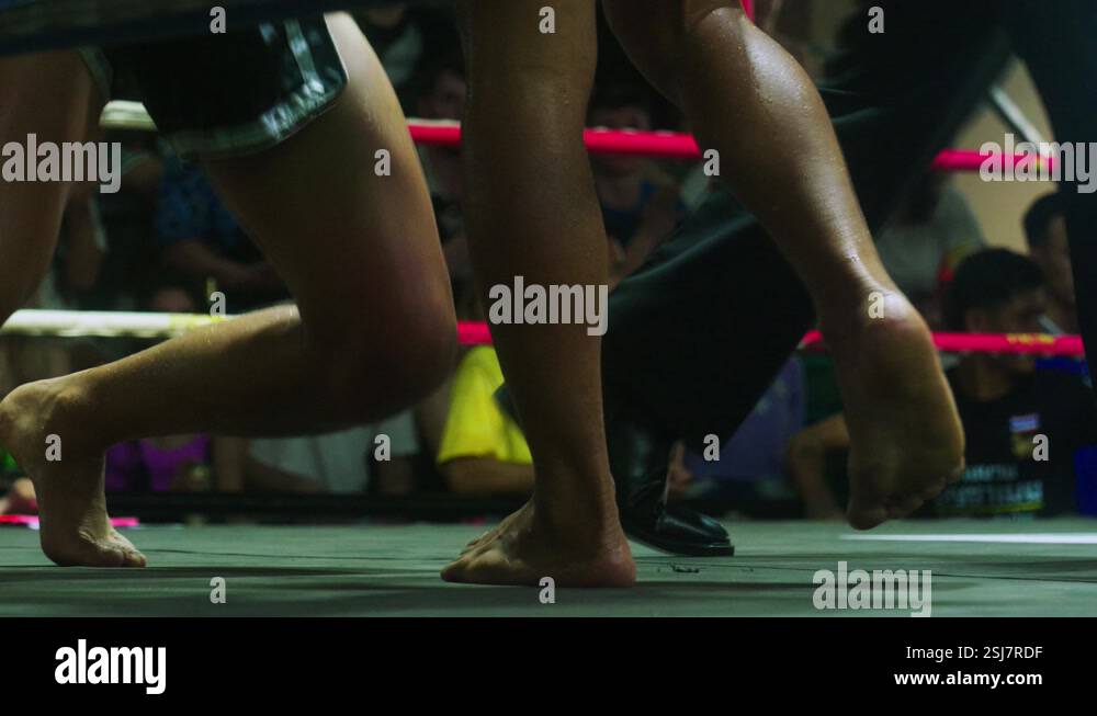 4K Cinematic slow motion footage of two young Thai men fighters on a ...