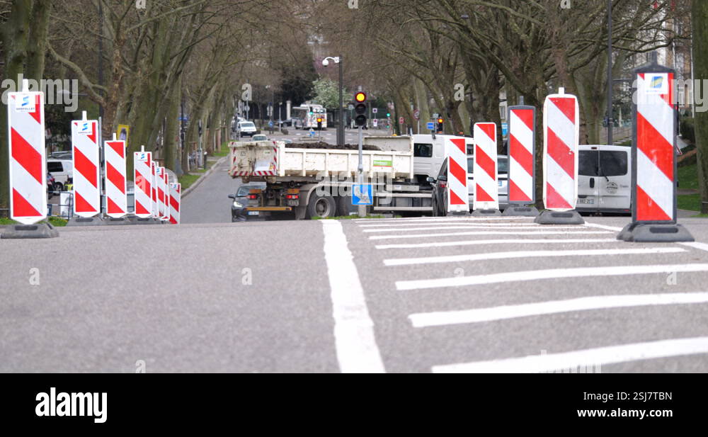 Cars whizzing by and people strolling along the Avenue de Europe Stock ...