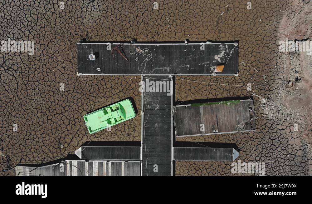 Empty reservoir and empty jetty on cracked ground. Aerial shot Stock ...