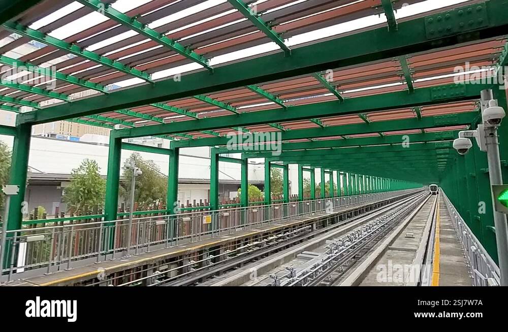 Train of Macau Light Rapid Transit System arriving Cotai East Station ...