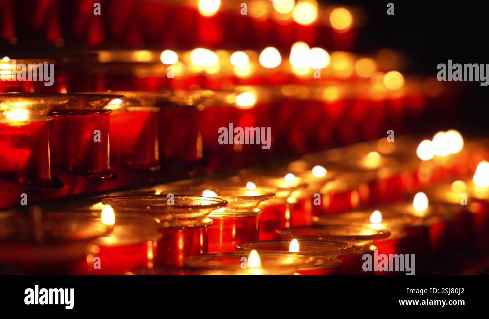 Many candles burn in a temple in Vienna, night, burning candles on the ...