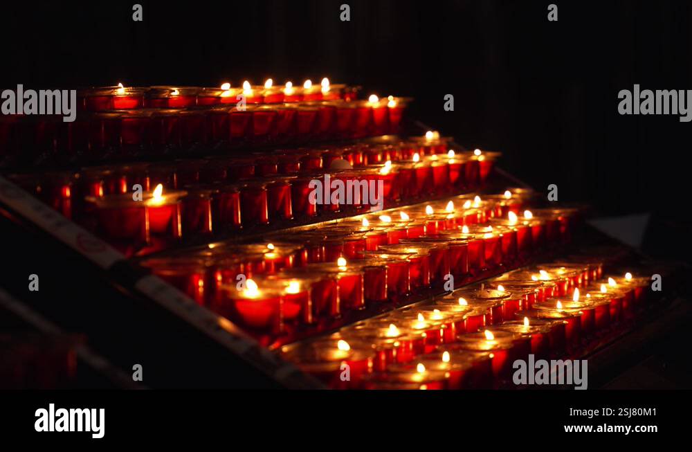 Many candles burn in a temple in Vienna, night, burning candles on the ...