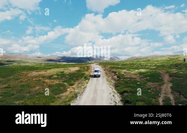 Aerial shot of epic mountain gravel road in national park. Overland ...