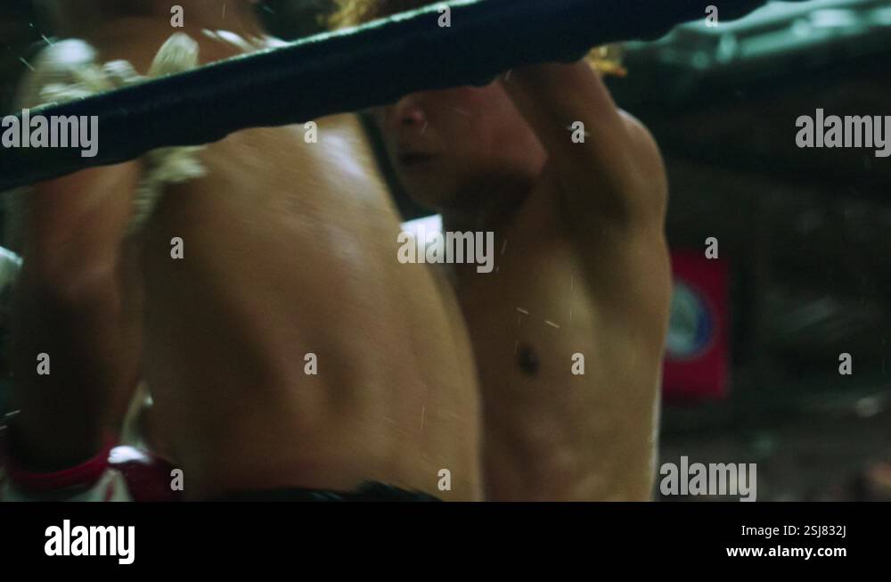 4K Cinematic slow motion footage of two young Thai men fighters on a ...