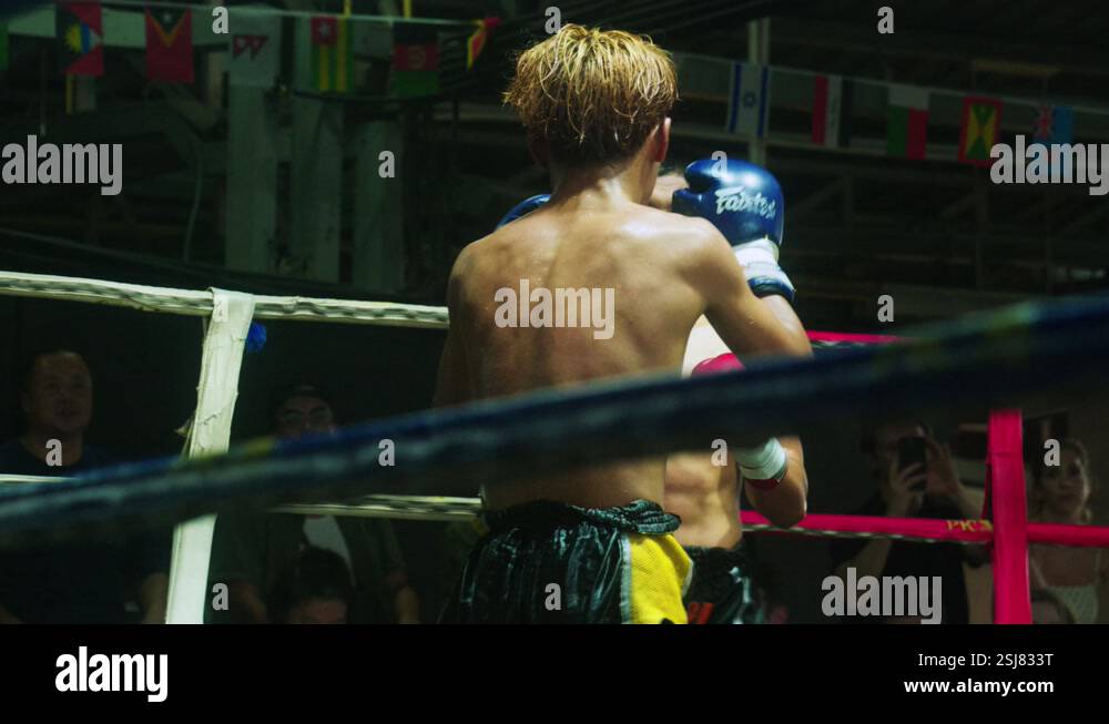 4K Cinematic slow motion footage of two young Thai men fighters on a ...