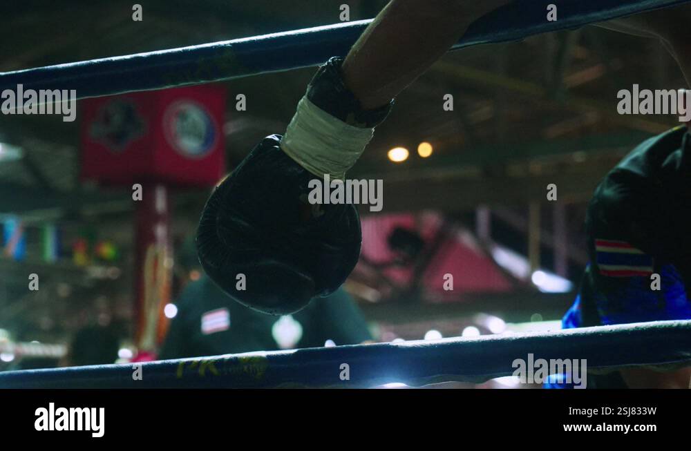 4K Cinematic slow motion footage of a boxing glove from a Thai fighter ...