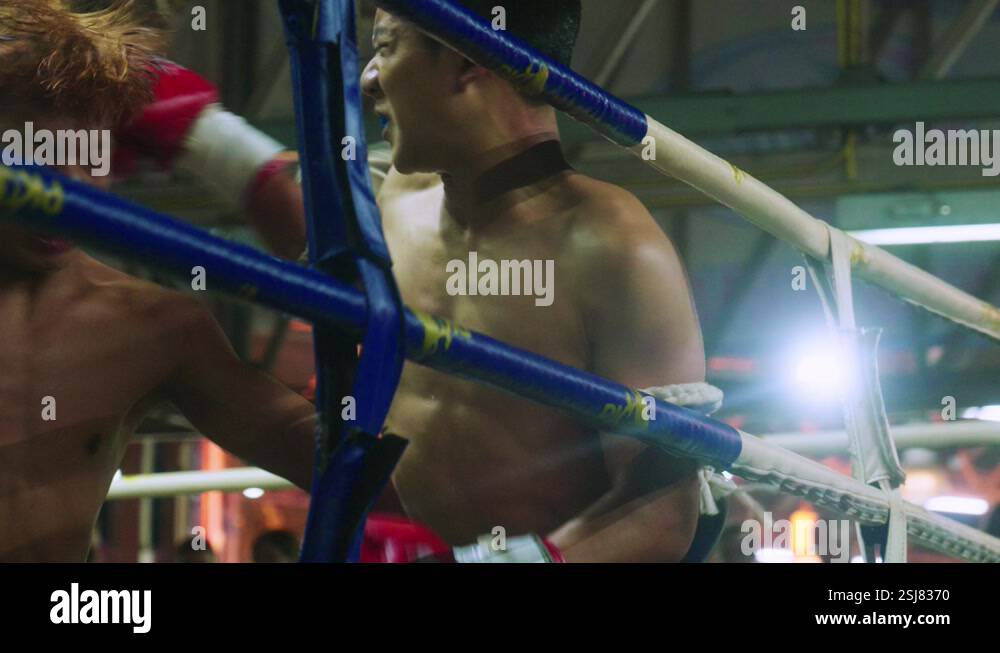 4K Cinematic slow motion footage of two young Thai men fighters on a ...