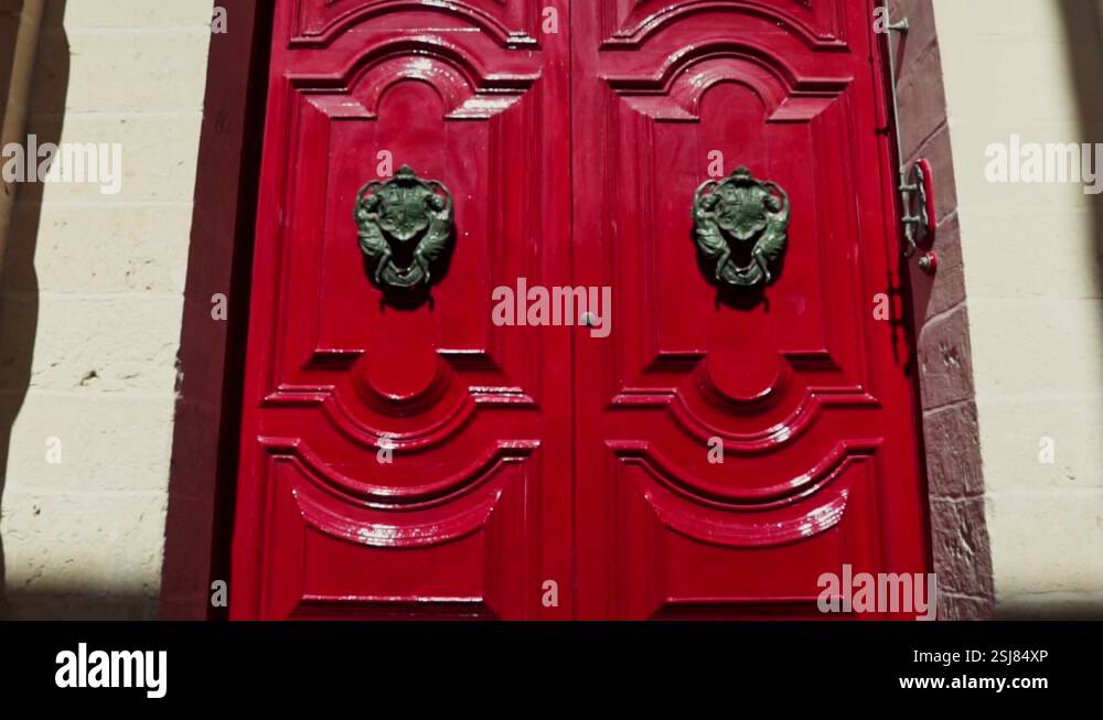 Reveal of red doors with a huge door knobs of an old building Stock ...