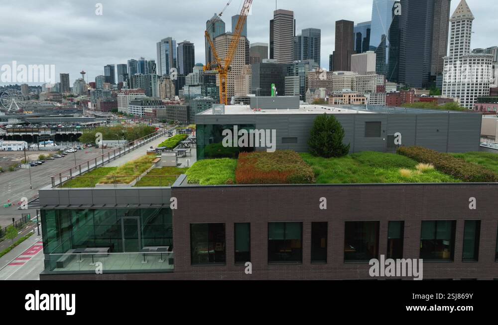 Drone shot rising over a fancy apartment building to reveal a well ...