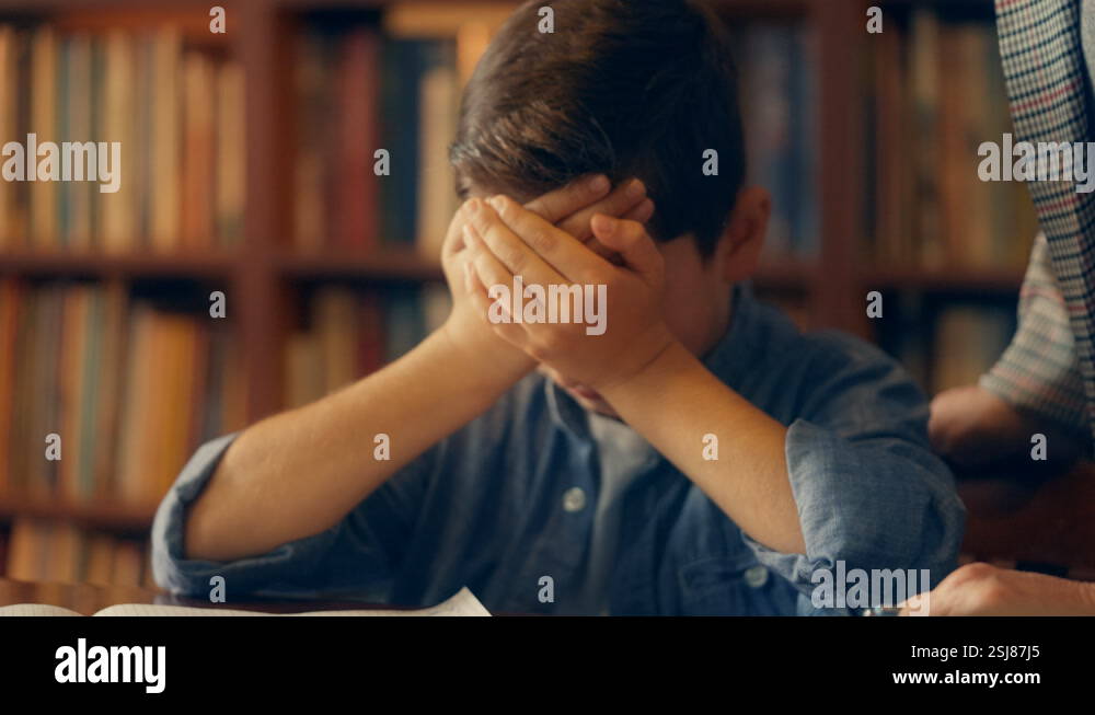 Strict female teacher talking harshly to unhappy boy during lesson ...