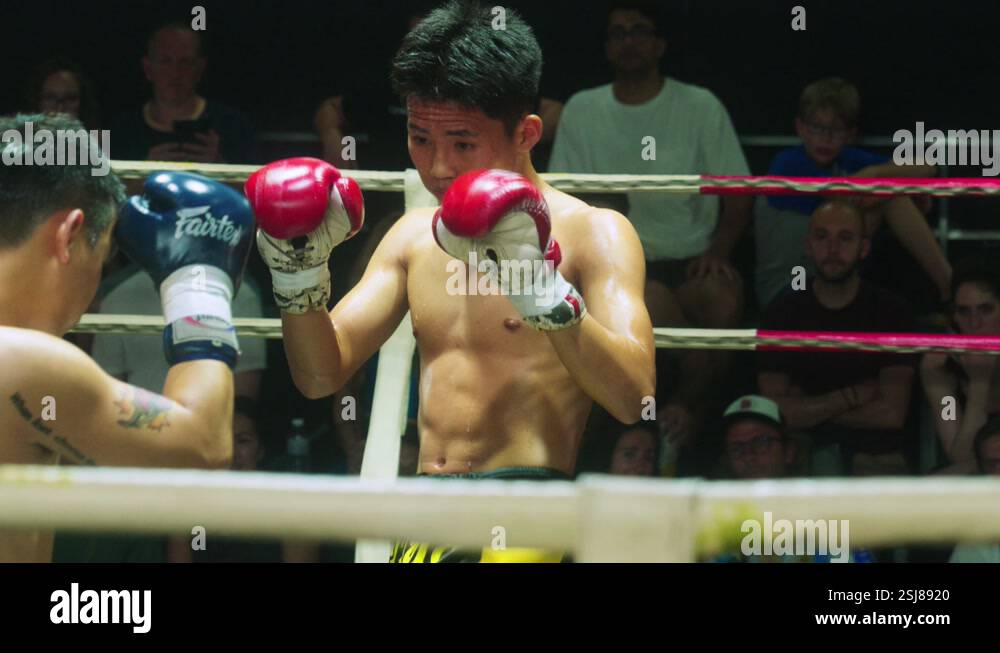 4K Cinematic slow motion footage of two Thai fighters fighting on a ...