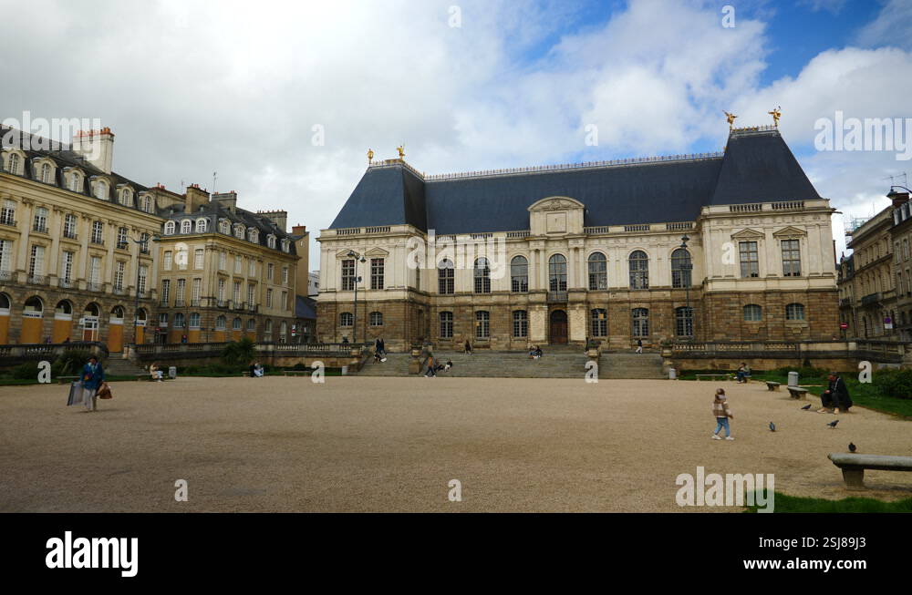 People walking in front of Palace of parliament of Brittany town square ...