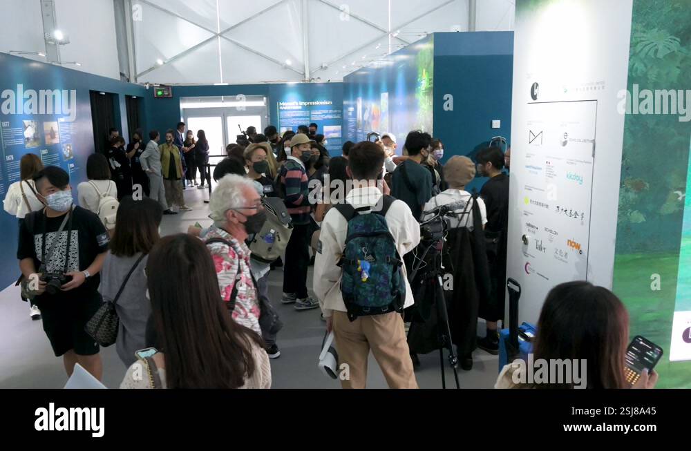 People visit the animated and immersive 360 degrees projections ...