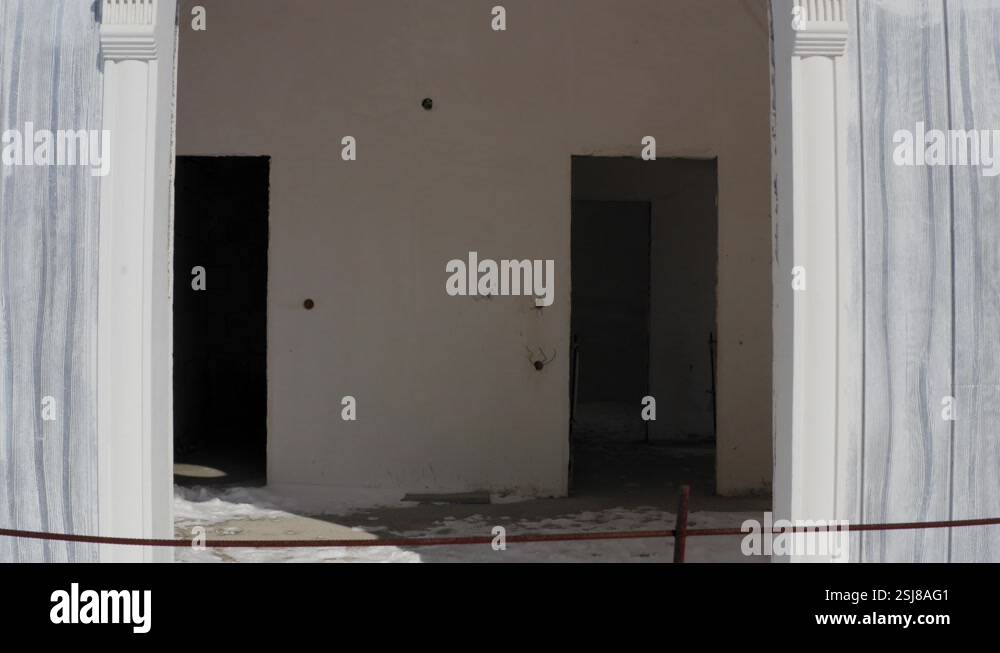 Unfinished double story home of grey wood and royal window frames in ...