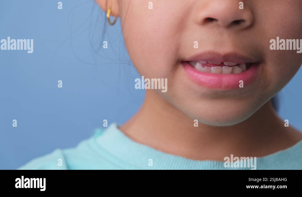 Close-up inside the oral cavity of a healthy child with beautiful rows ...