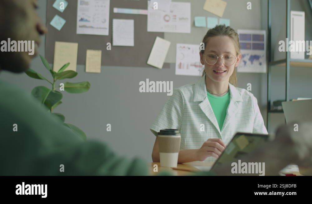 Gen Z Girl Speaking with Coworker during Business Meeting Stock Video ...
