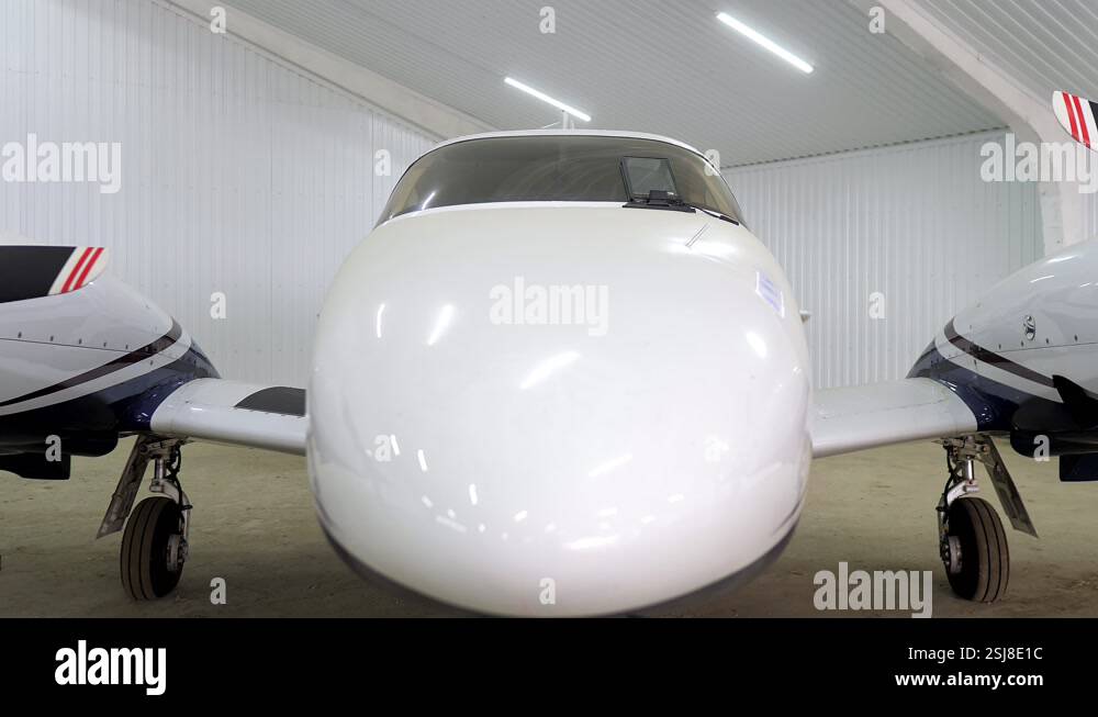 Front view of engine propeller airplane standing in a closed aircraft ...