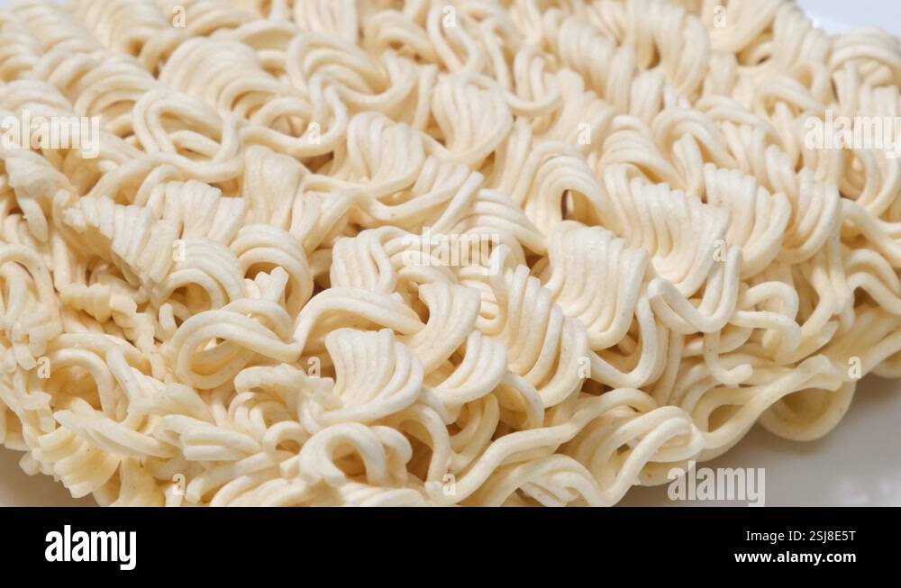 Instant pasta rotates in a circle. Raw macaroni top view Stock Video ...