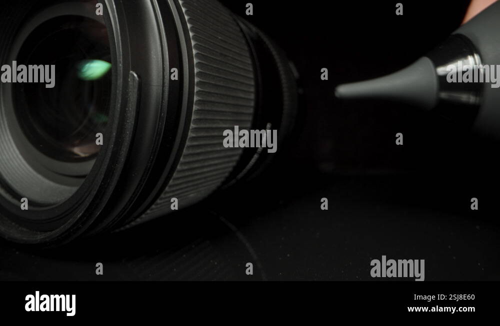 The lens from the camera is on a black glass table, I blow the dust off ...