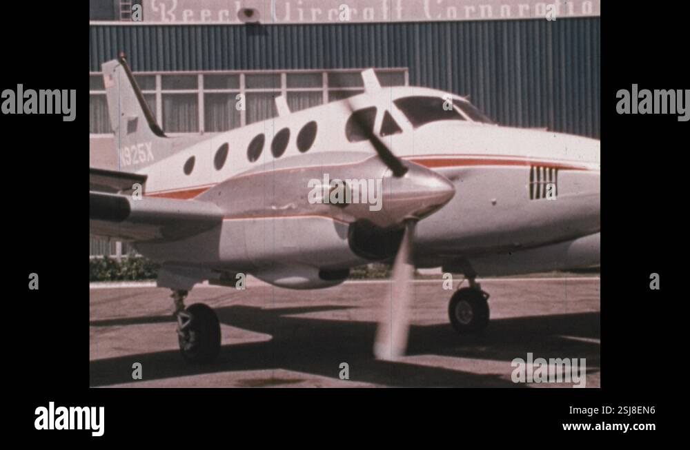 1970s: An propeller whirrs on sitting plane. A plane engine without a ...