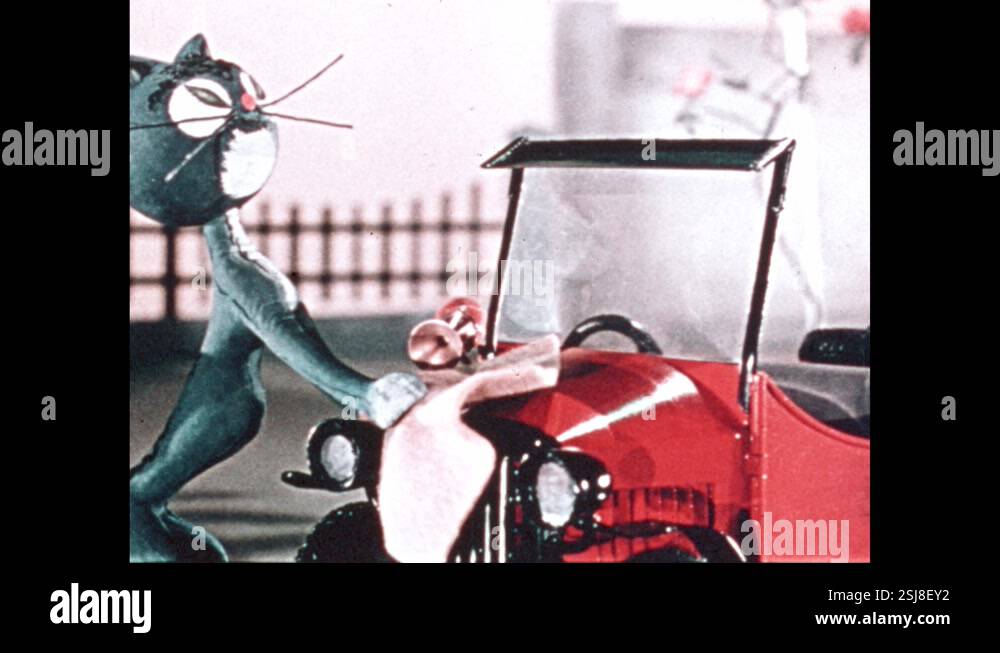 1970s: Stop motion cat uses rag to clean a car. Fly lands on windshield ...