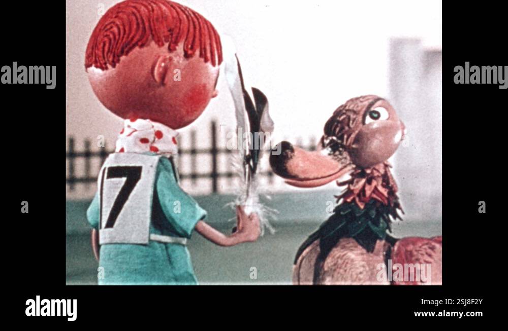 1970s: Stop motion mama duck puts duckling down. Boy shows duck ...