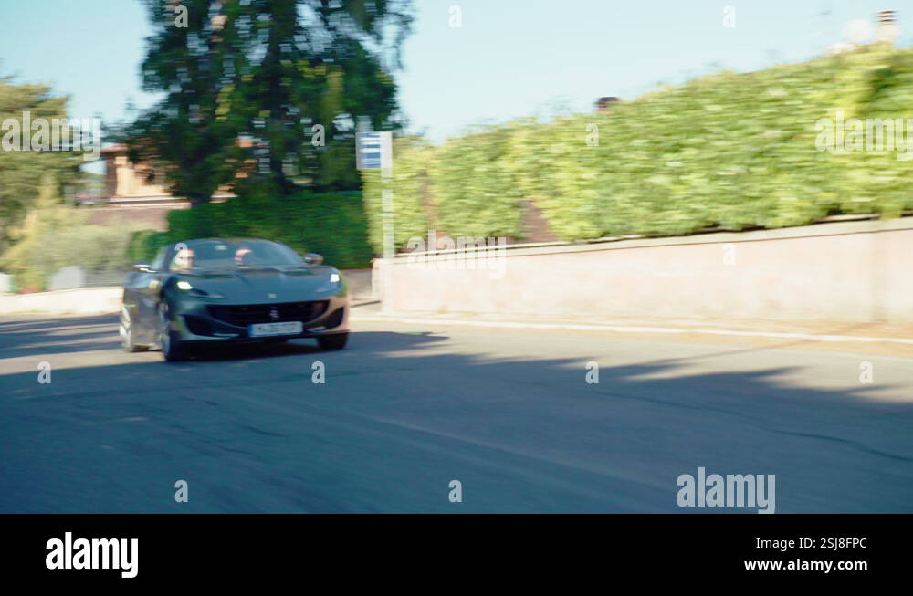 ROME, ITALY - NOVEMBER 7, 2022: Powerful grey Ferrari driving with fast ...