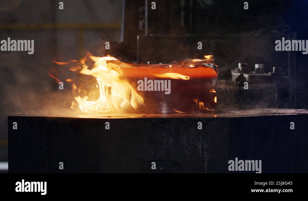 Super slow motion of industrial metal forging. Fire and sparks ...