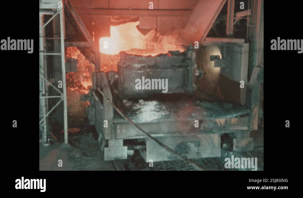 1980s: Molten metal pouring into vat. Vat of metal pulling from oven ...