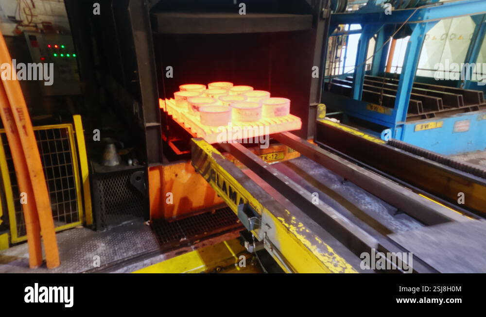 Metal parts inside an industrial furnace during forging process ...