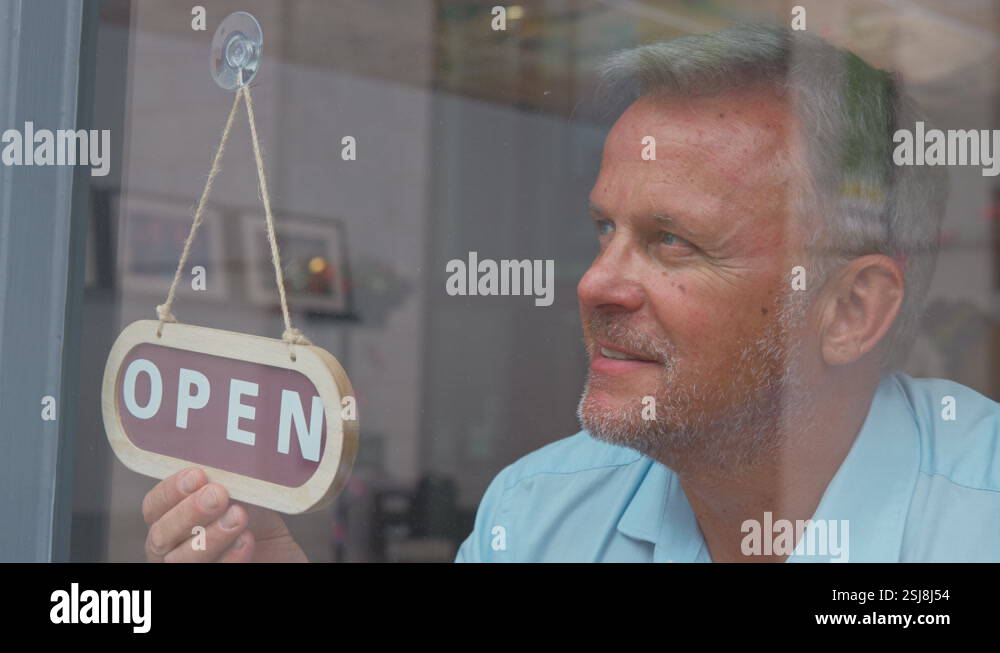 Mature Male Owner Or Staff Inside Shop Or Cafe Turning Round Sign From ...