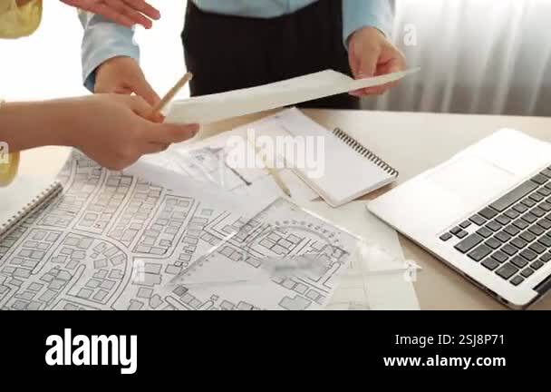 Architect and safety engineer write about construction detail blueprint ...