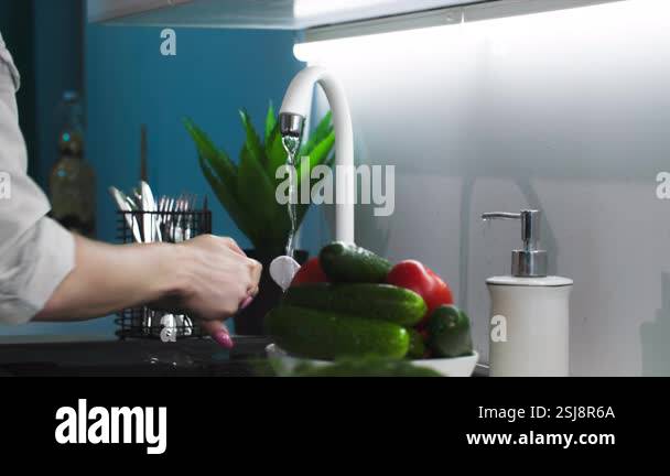 hygiene, woman using soap dispenser and washing hands with soap foam ...