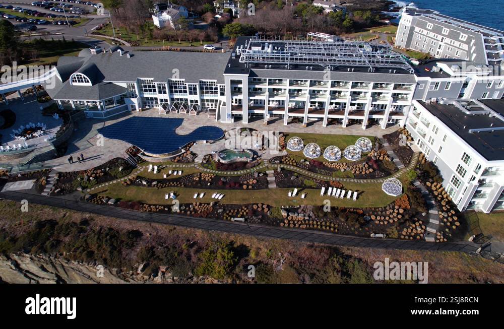 4k flyover of luxury cliffside resort on the Atlantic ocean of southern ...